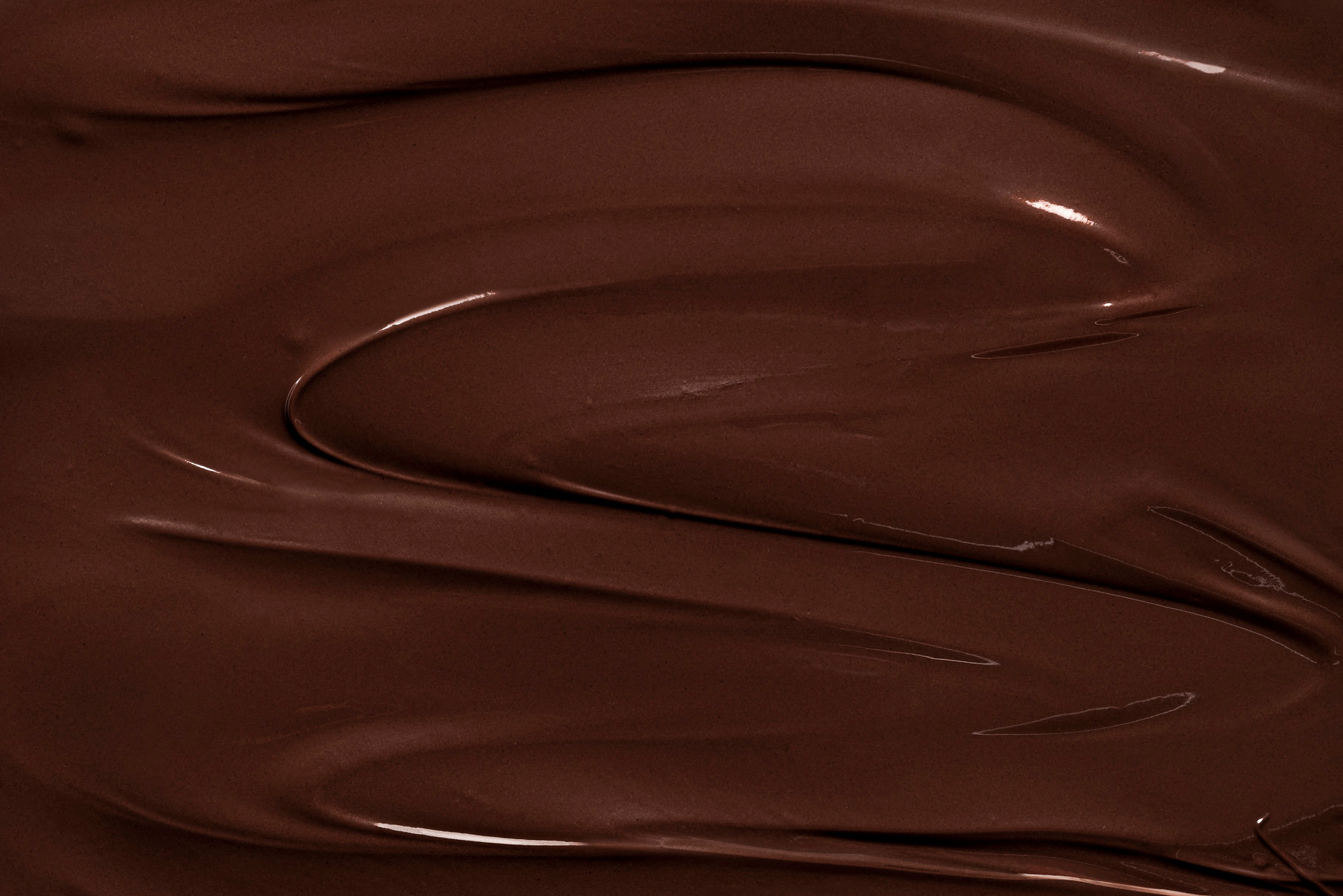 Melted chocolate texture, full-frame. Dark chocolate swirl backg, a ...