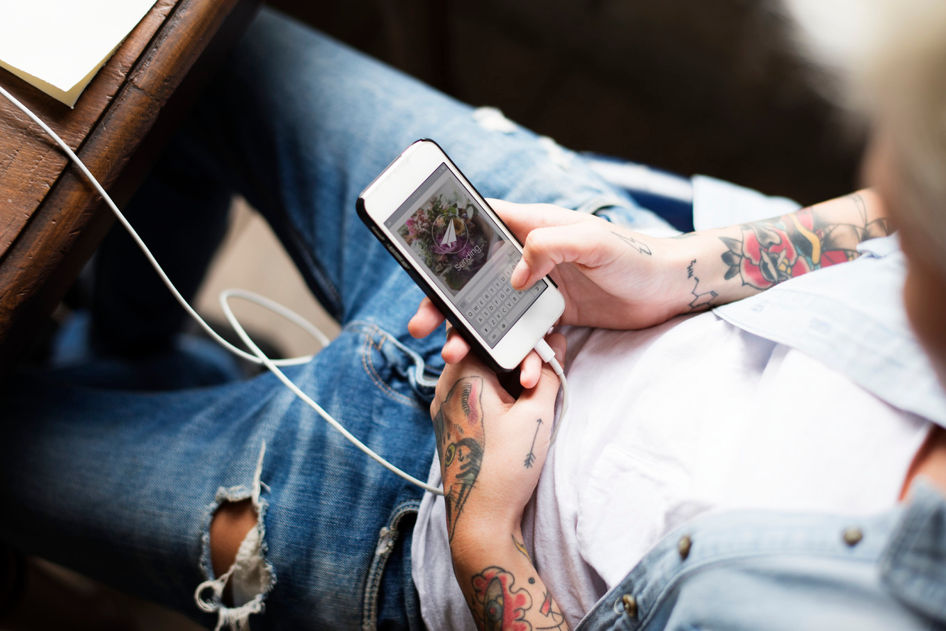Woman using mobile phone featuring jeans, body, and mobile, a Person ...
