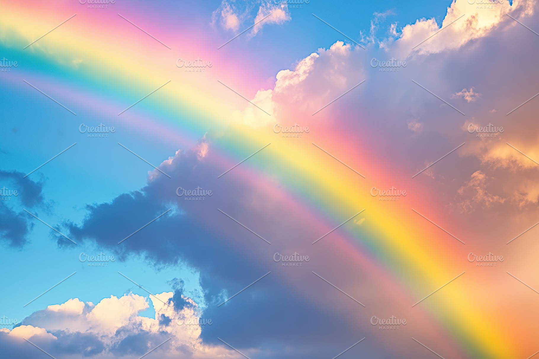 Vibrant rainbow arches across the sunset sky after a refreshing rain ...