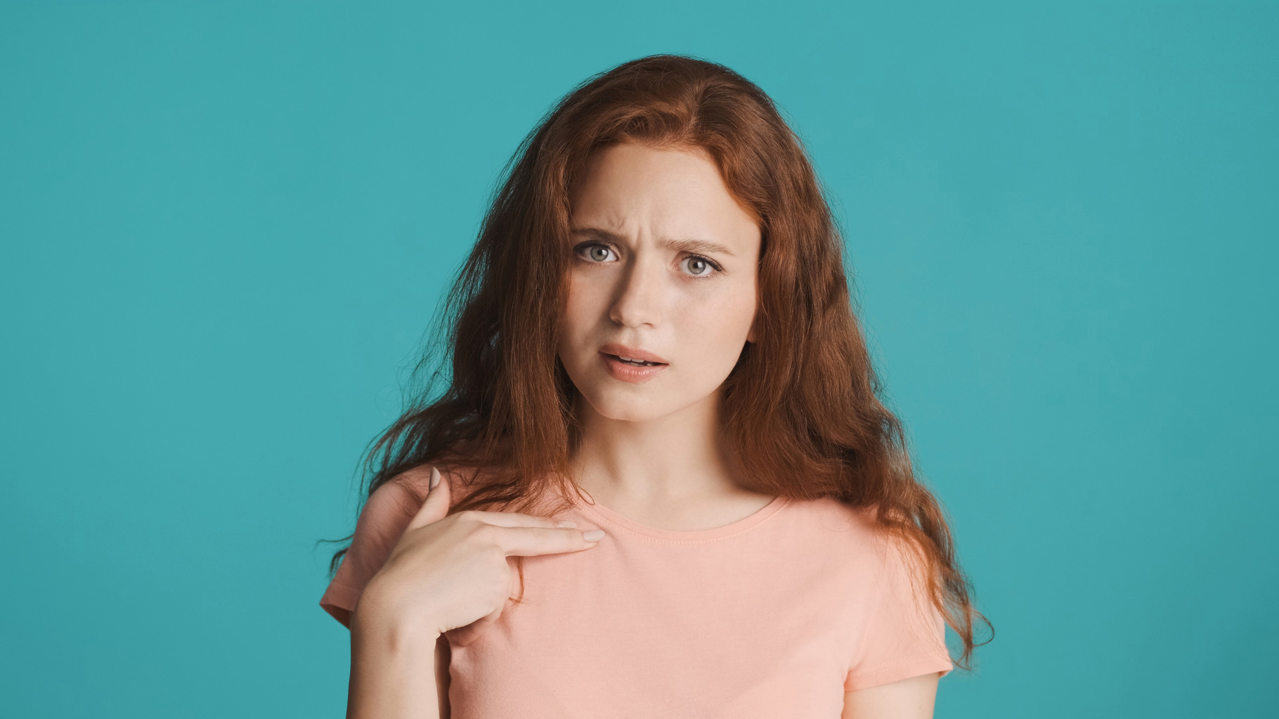Confused girl pointing finger on her, a Person Photo by Garetsworkshop