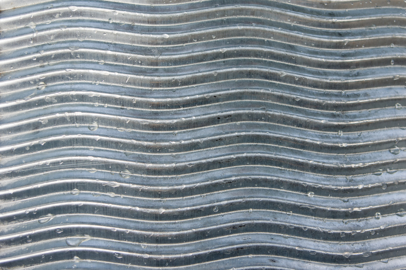 Wavy metal pattern, an Abstract Photo by Zigzag Mountain Art