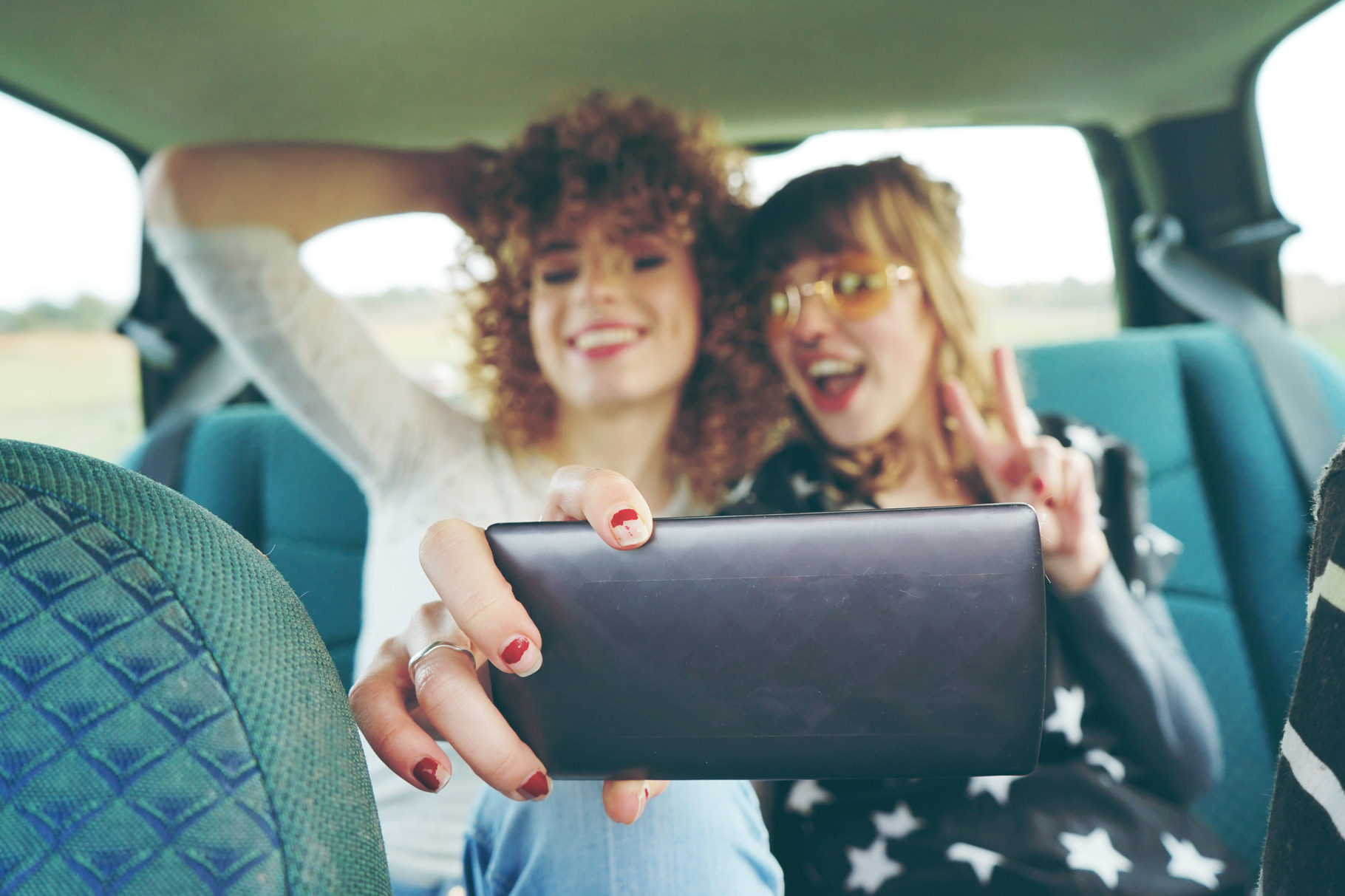 Two friends with their mobile phones featuring women, friends, and ...