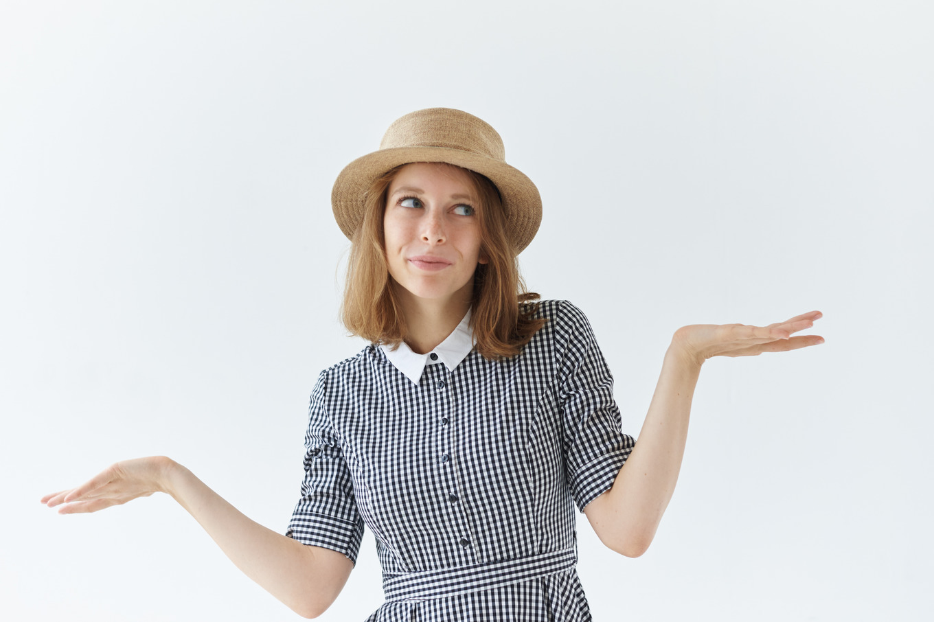 Isolated portrait of beautiful charming young female shrugging ...