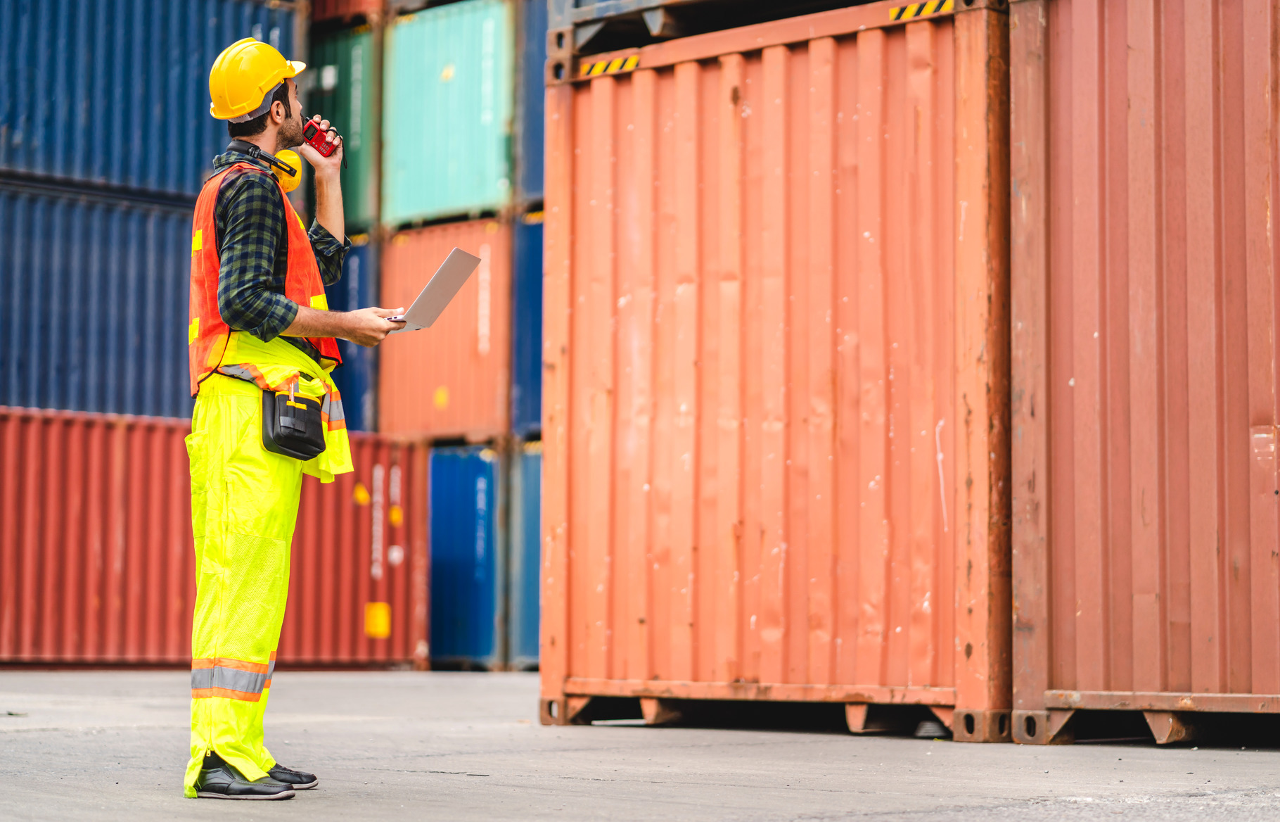 Professional engineer container cargo foreman in helmets working, a ...