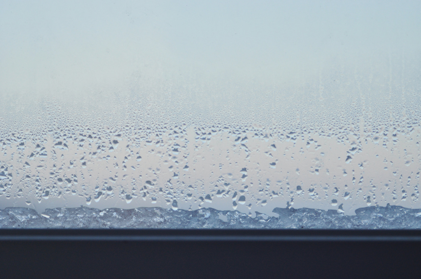 Rain and Ice on a Window Sill, a Nature Photo by Topographically