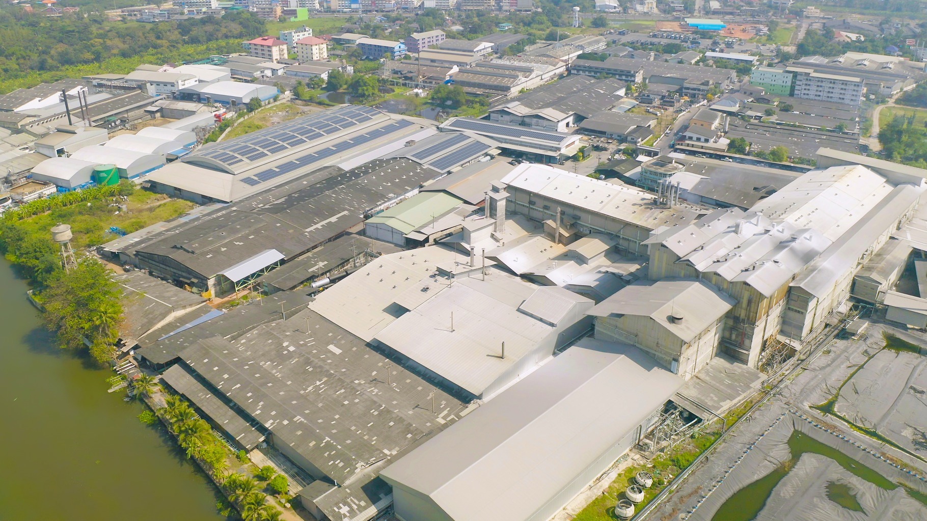 Aerial top view of factory industry. Electricity tower building, a ...