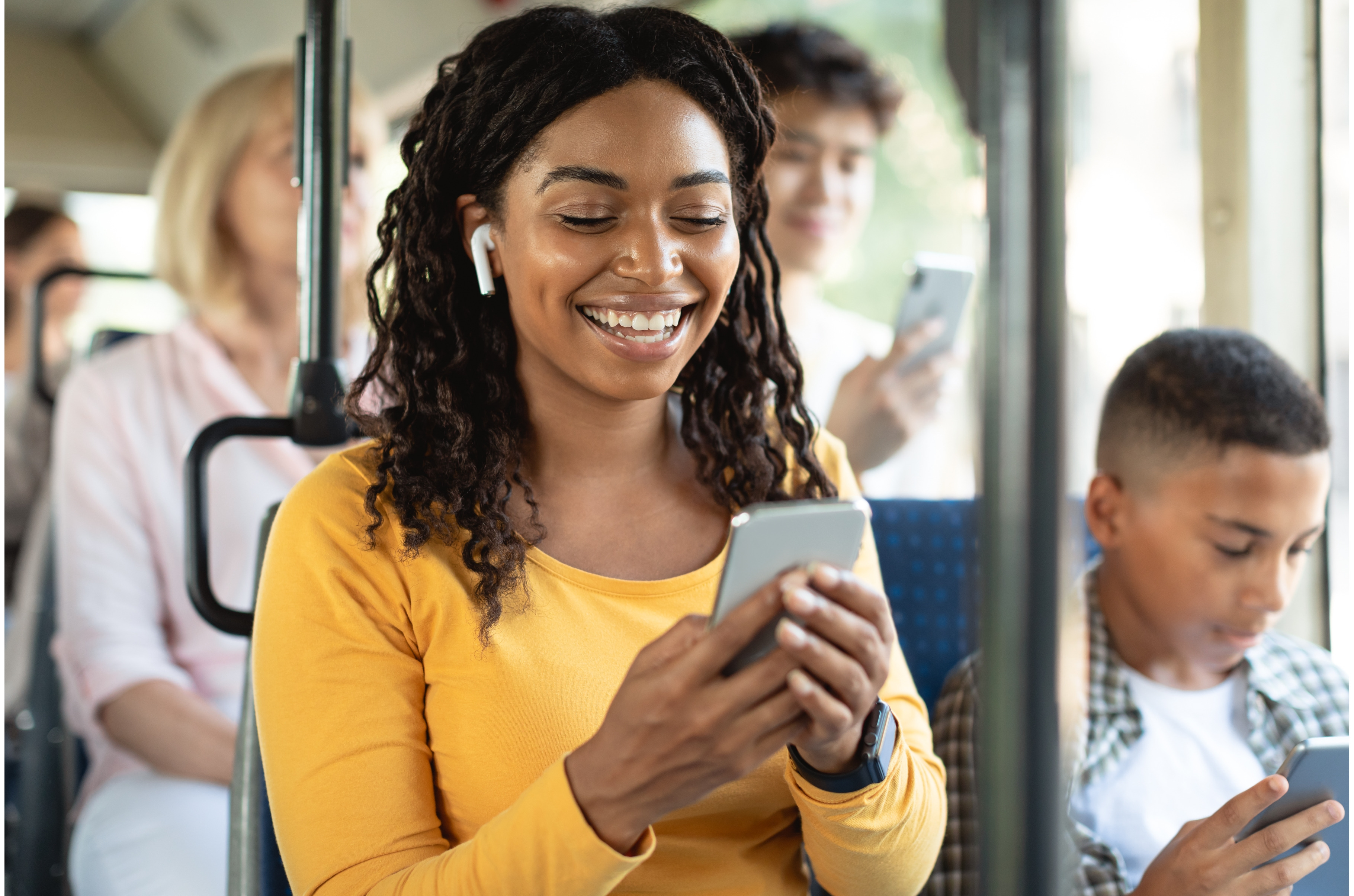 Happy black lady using smartphone, a Technology Photo by Prostock-Studio