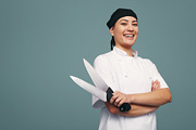 Cheerful culinary chef smiling while holding two knives, a Person Photo ...
