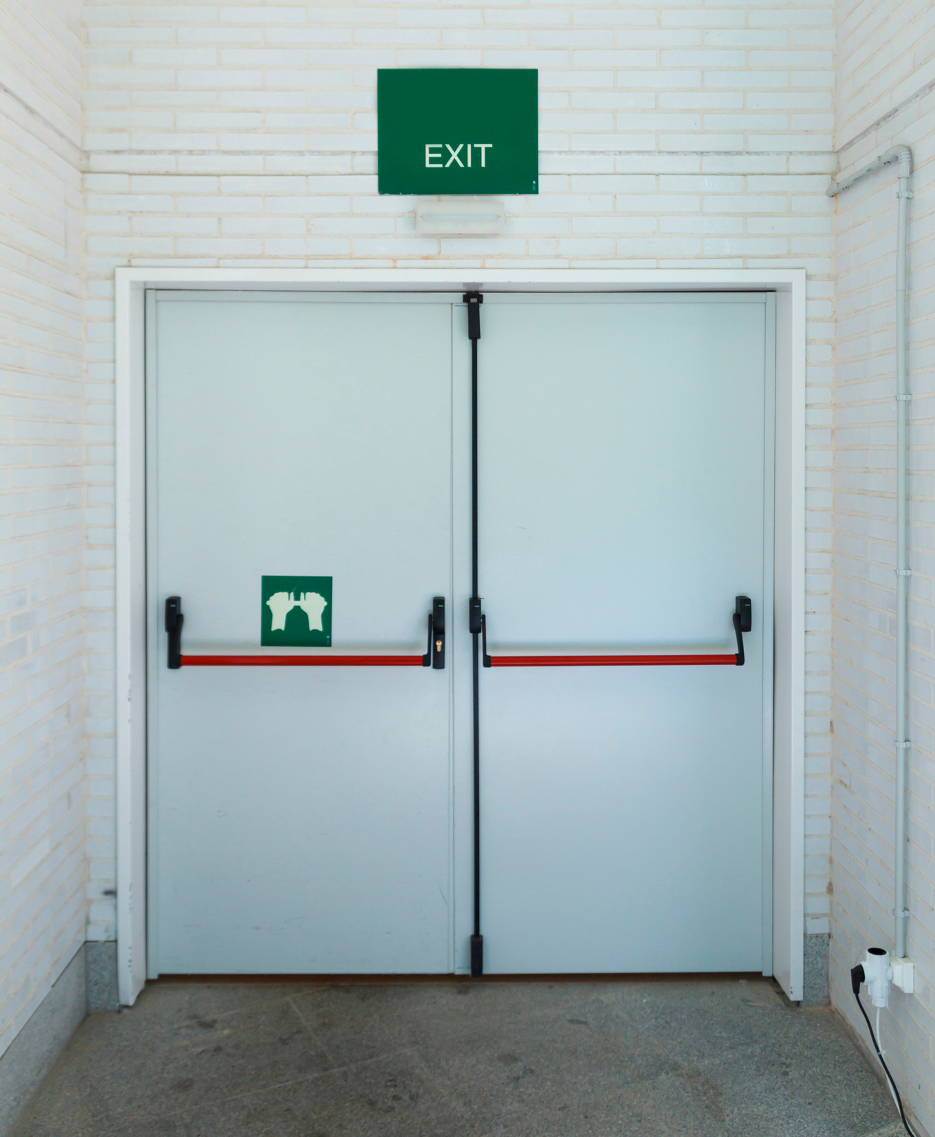 Emergency exit door featuring exit, fire, and emergency, an ...