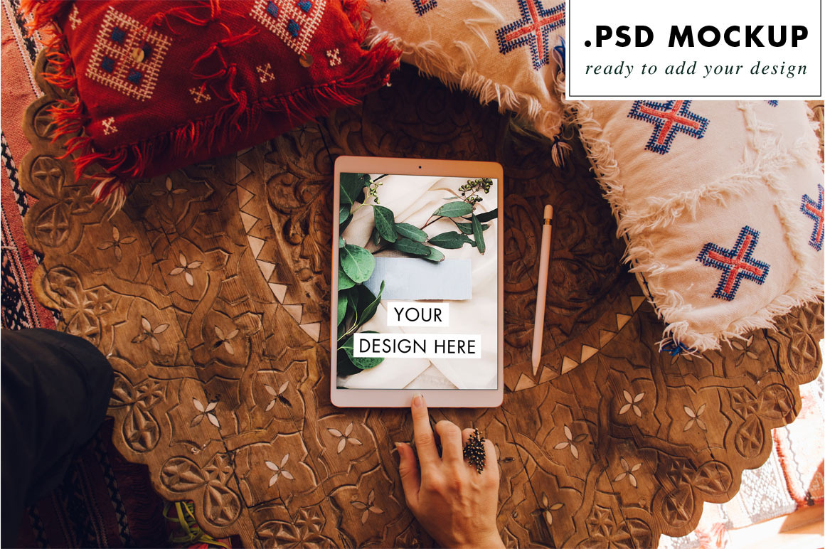 ipad mockup with hand and table wood, an iPad Mockup by Travelling Mockups