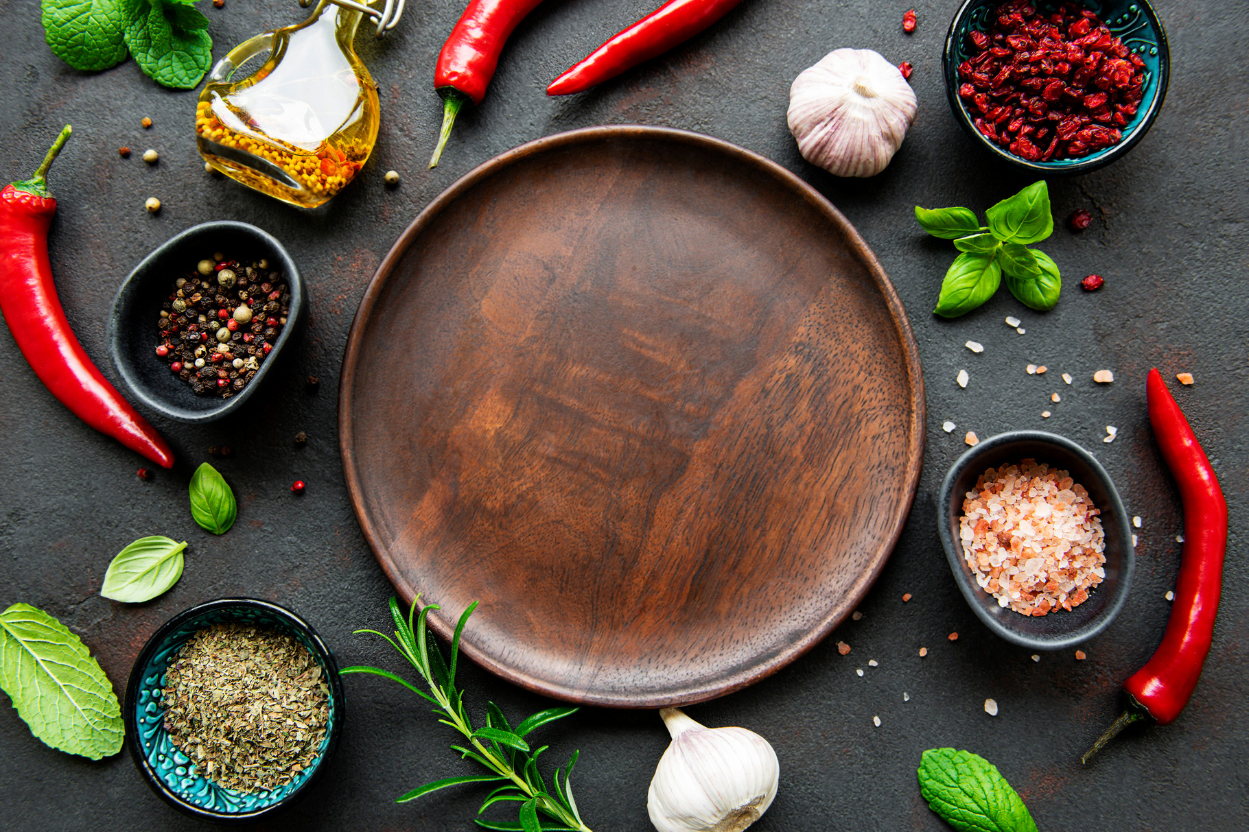 Empty wooden plate and frame of spic containing spice, board, and ...