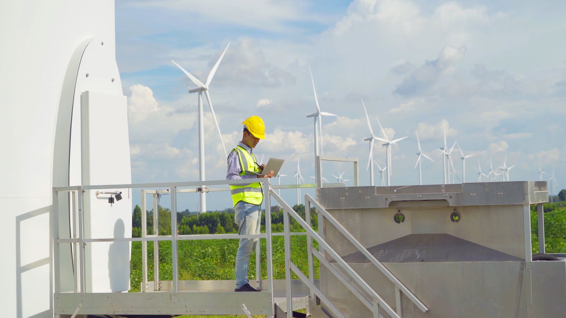 Portrait of Asian windmill engineer man, worker working, using a, a ...