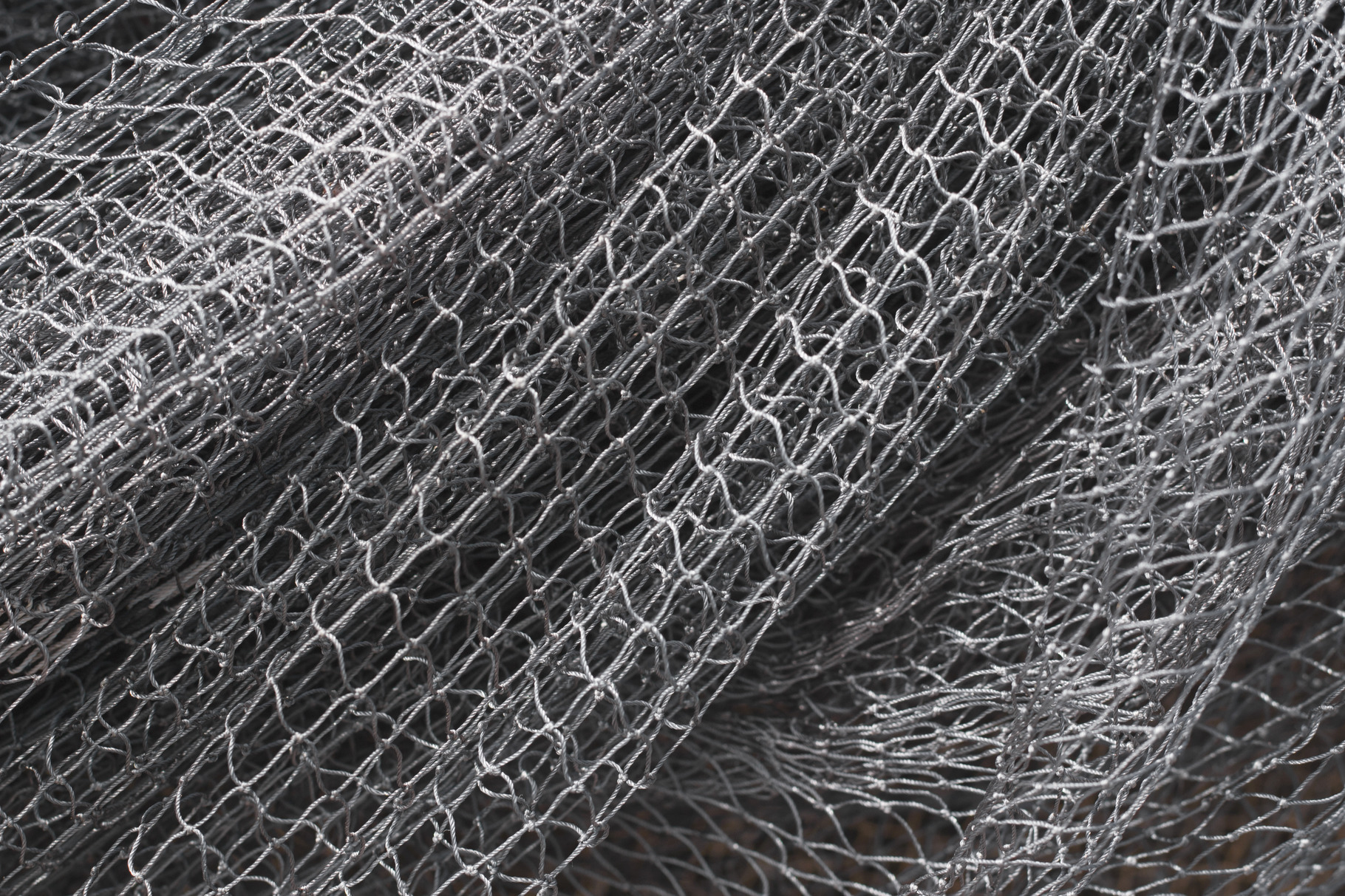 Gray texture fishing net. Close up p, an Abstract Photo by Olha Kozachenko