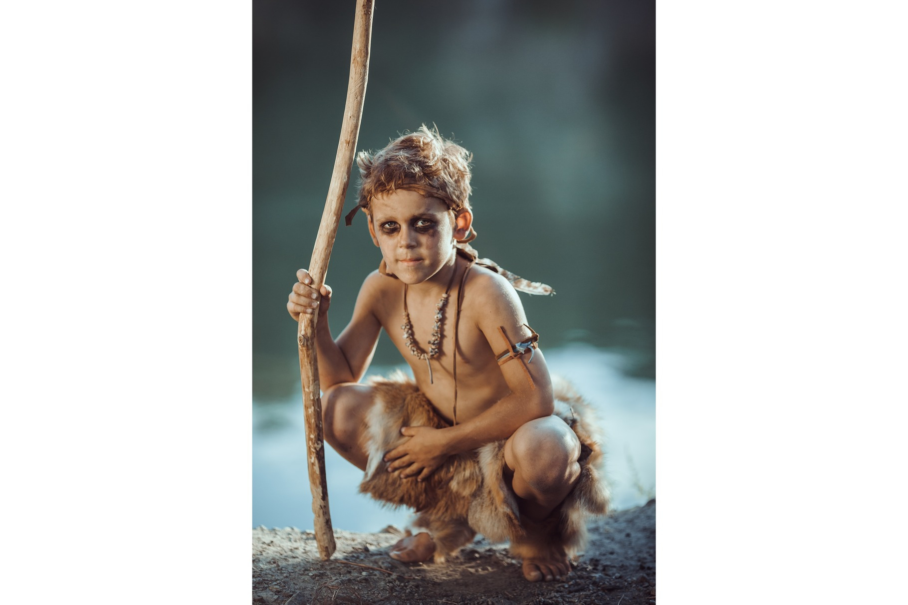 Cute caveman, manly boy with staff, a Person Photo by Emotion photo