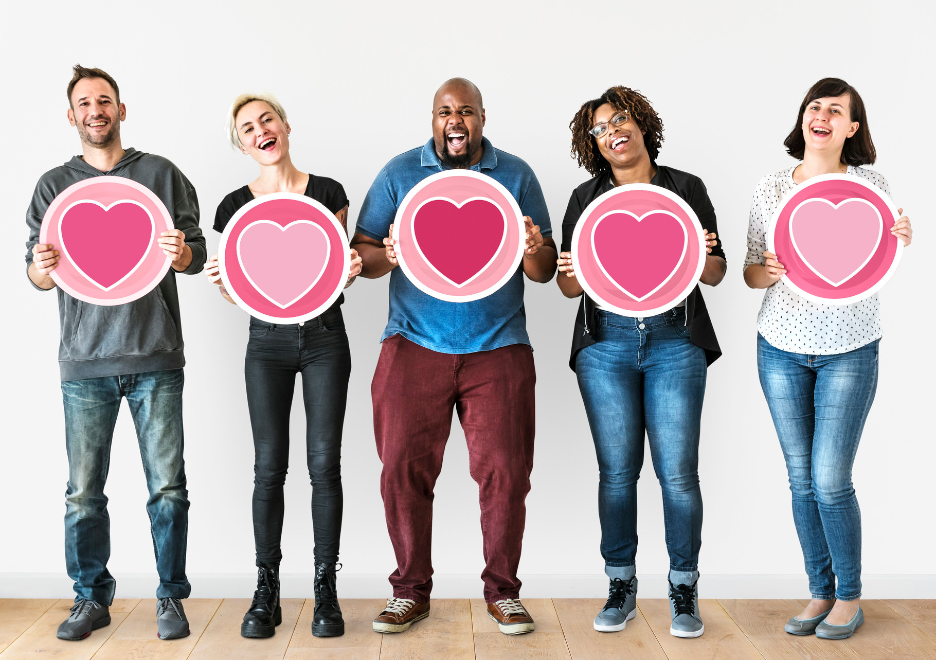 Diverse people holding heart icons, a Photo by rawpixel