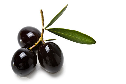 Ripe black olives with leaves on a white background stock photo ...