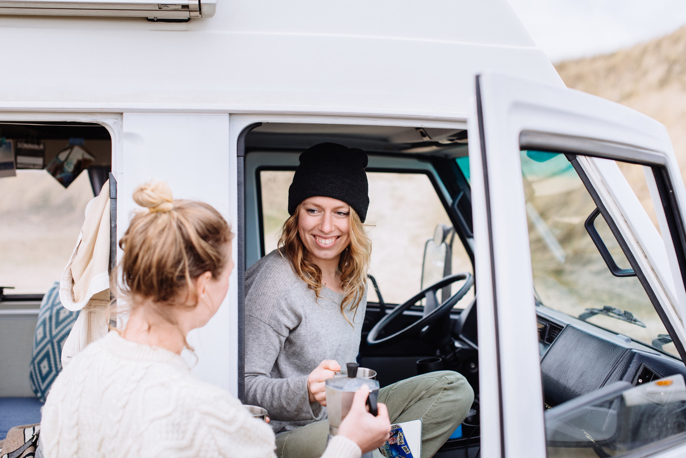 Two friends talking at camper van containing outdoor, sport, and active ...