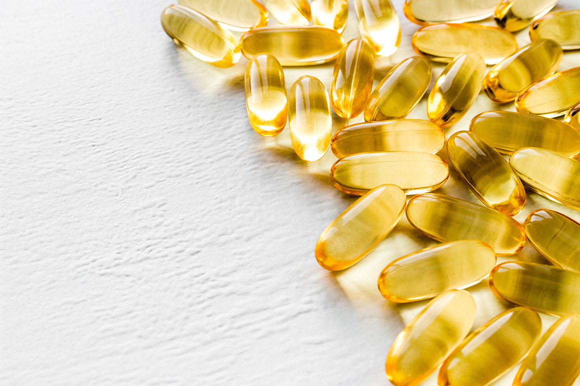 fish oil on a white background, a Health & Medical Photo by itakdalee