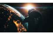 close up spaceman look at Earth, a Person Photo by Goinyk