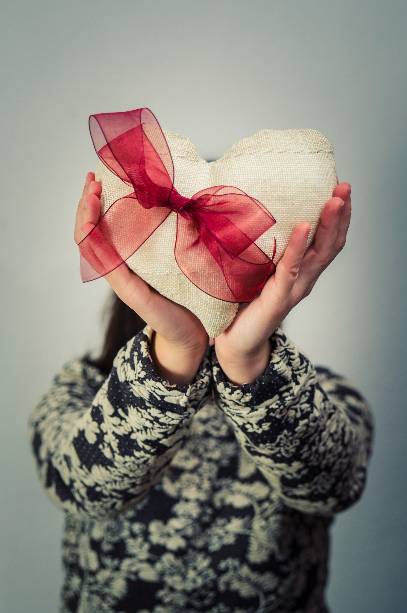 Woman hiding his face with a heart, a Holiday Photo by Irantzu ...