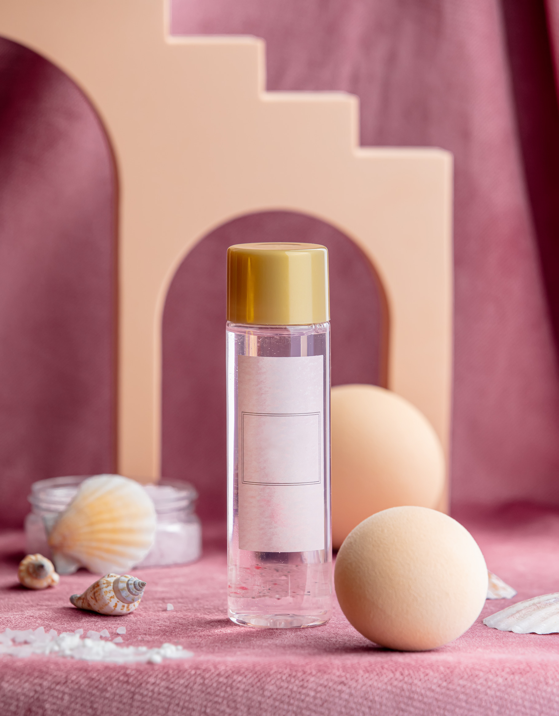 presentation of cosmetic containers next to geometric shapes and, a ...