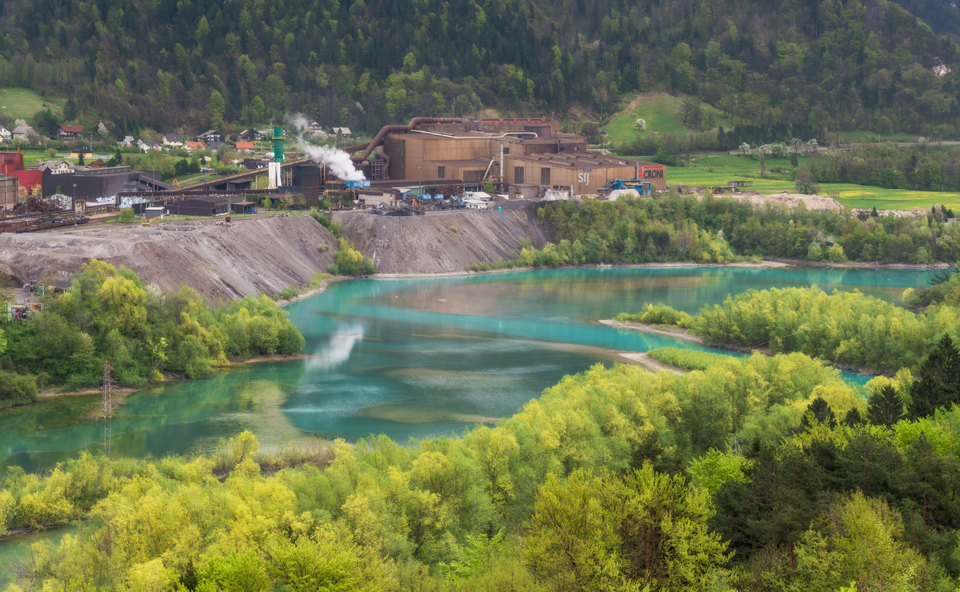 Steel factory over an emerald river stock photo containing factory and ...