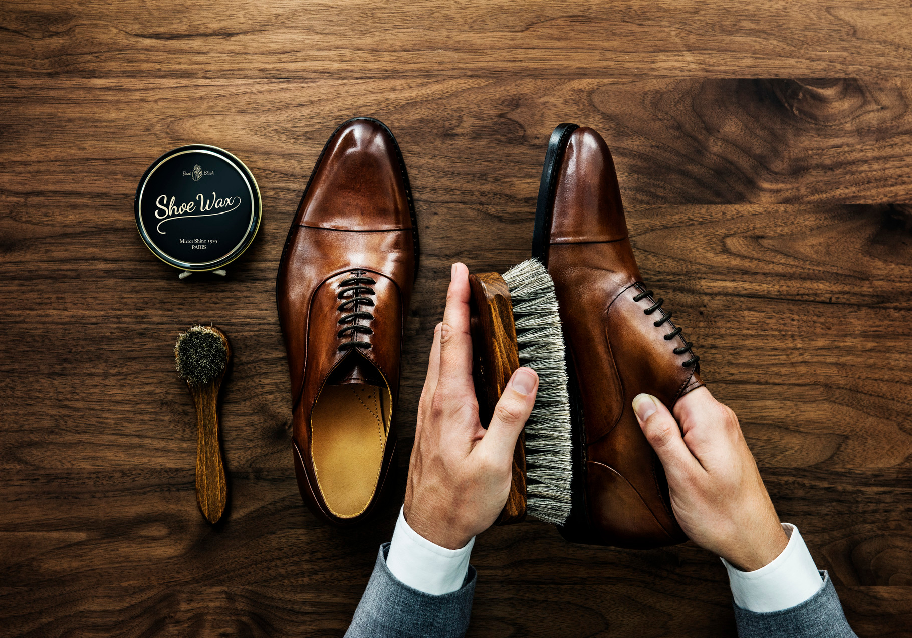 Businessman cleaning his shoes featuring aerial, aerial view, and ...