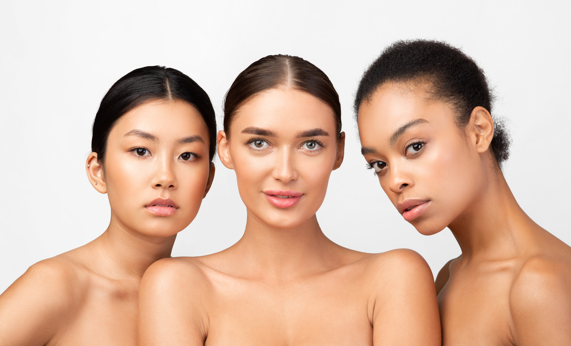 Three Multiracial Models Girls Posin, a Background Photo by Prostock-Studio