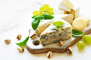 Various types of cheese and snacks, a Food & Drink Photo by Olena Rudo