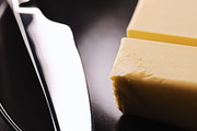 Sliced organic butter block and knife, breakfast food, a Food & Drink ...
