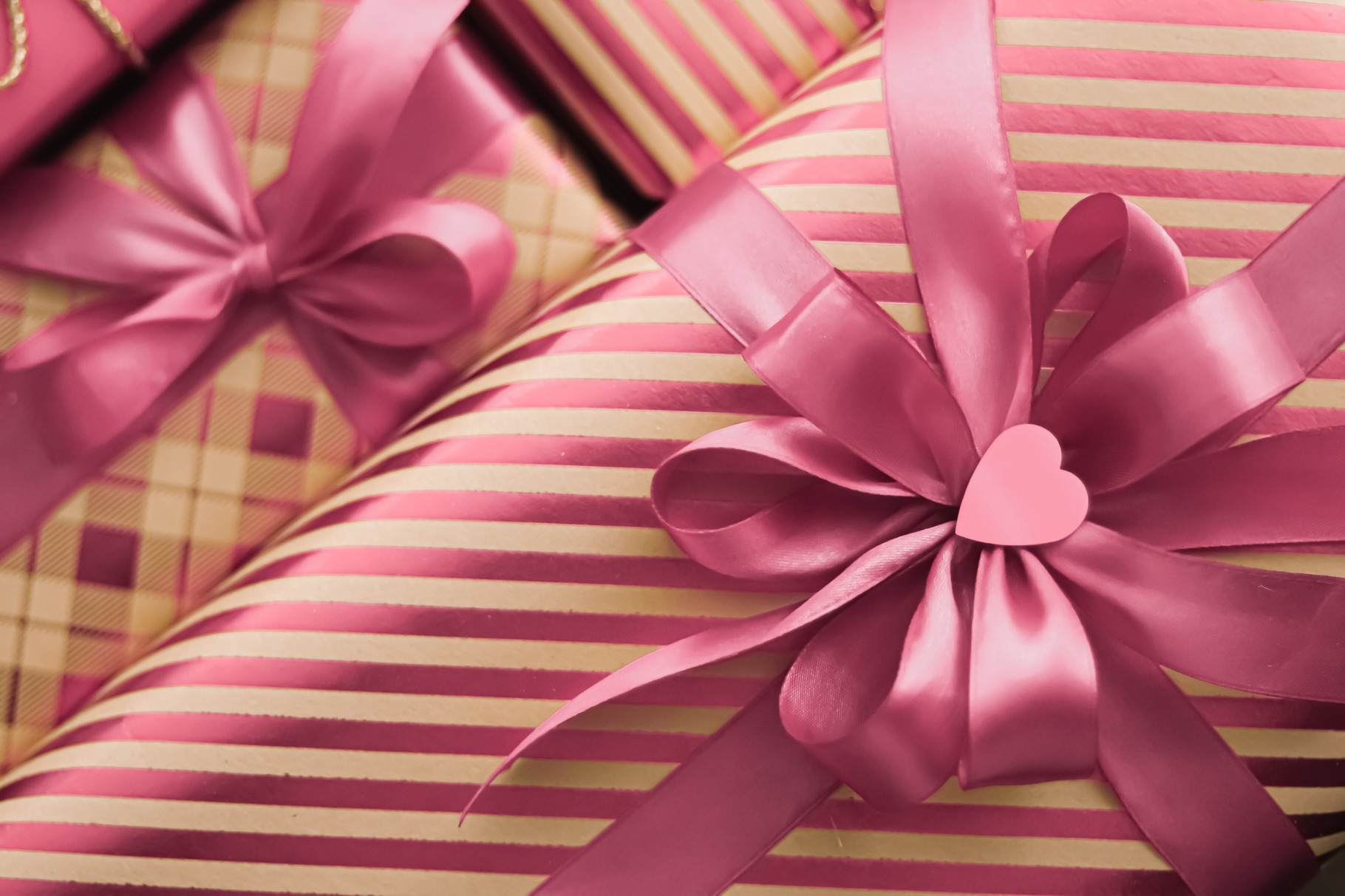 Holiday gifts and wrapped luxury presents, pink gift boxes as su ...