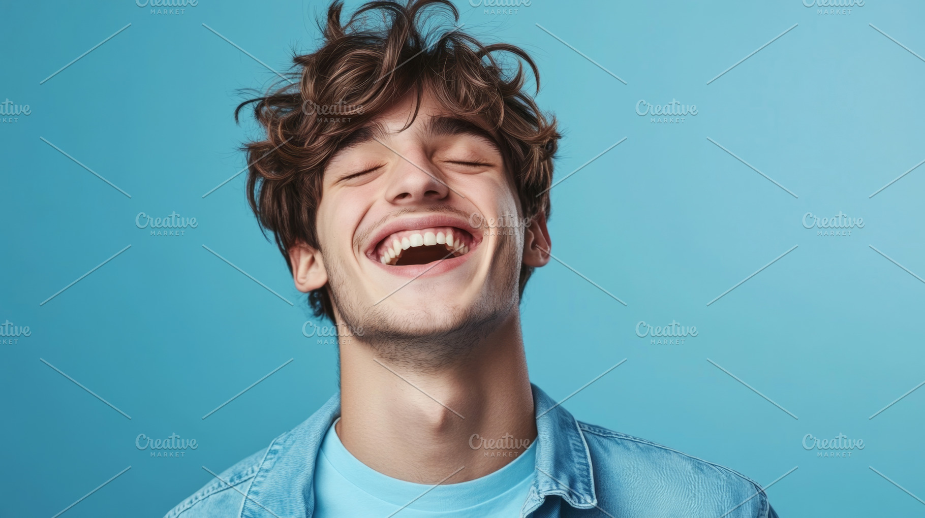 Joyful young man laughing with happiness on vibrant background, an ...