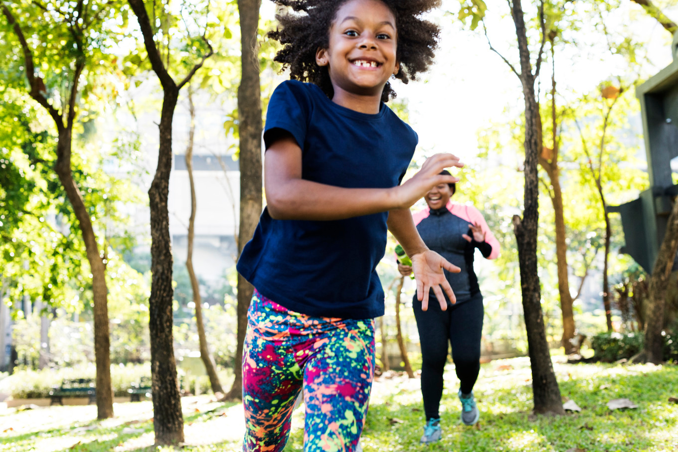 Black family having fun at park featuring parents, african, and ...