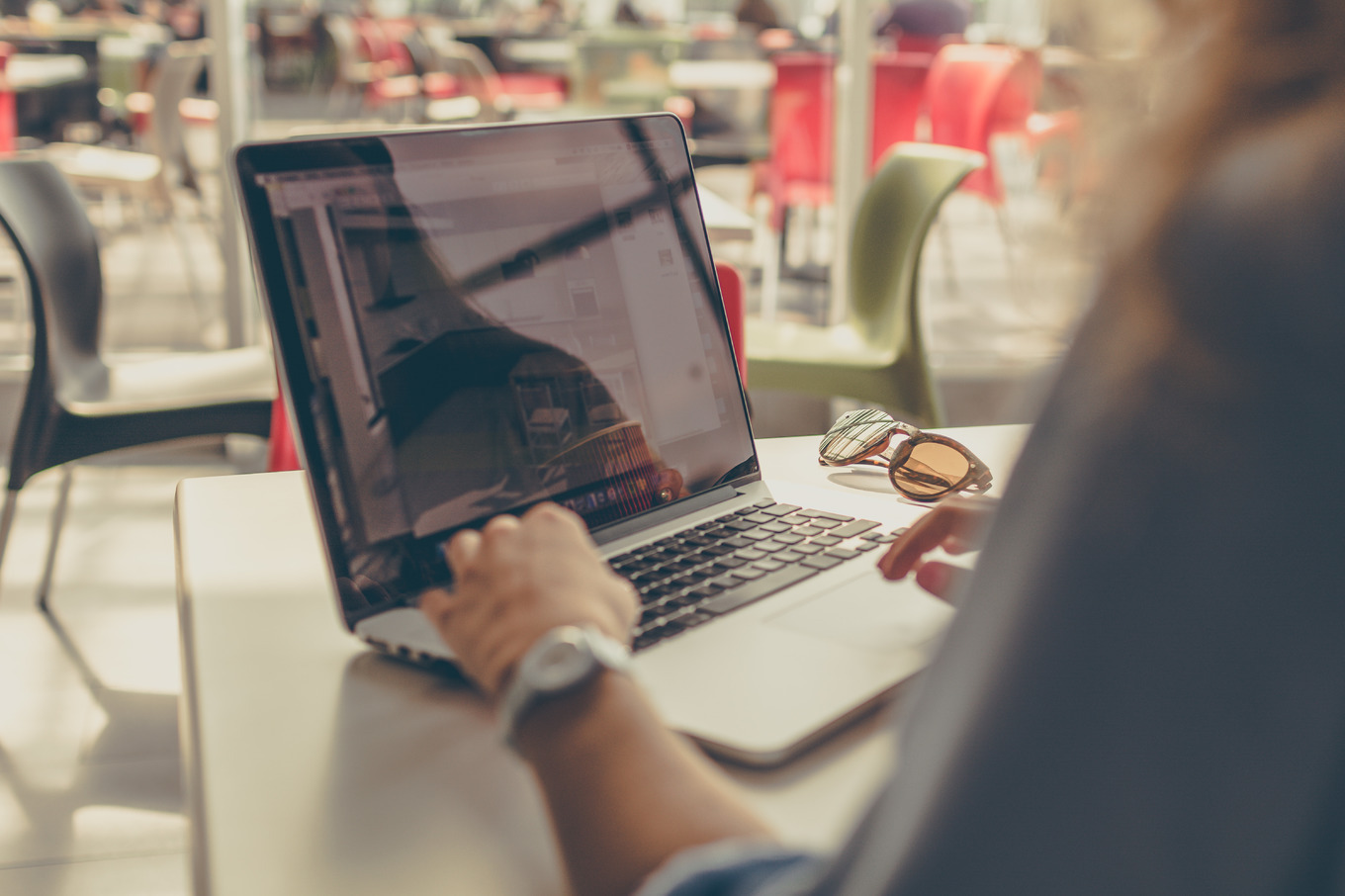 Young adult using laptop on terrace | Technology Stock Photos ...