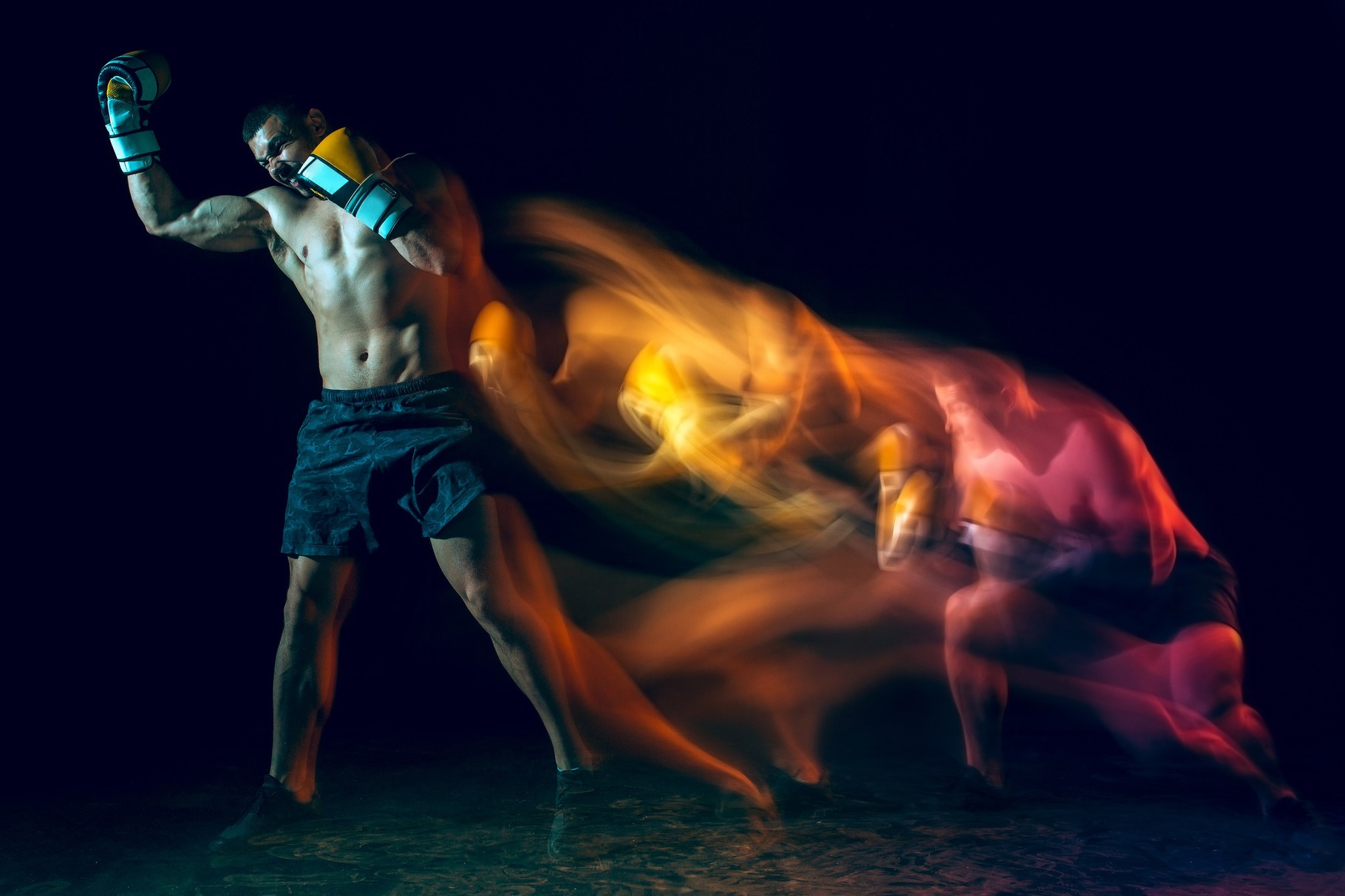 Male boxer boxing in a dark studio stock photo containing adult and ...