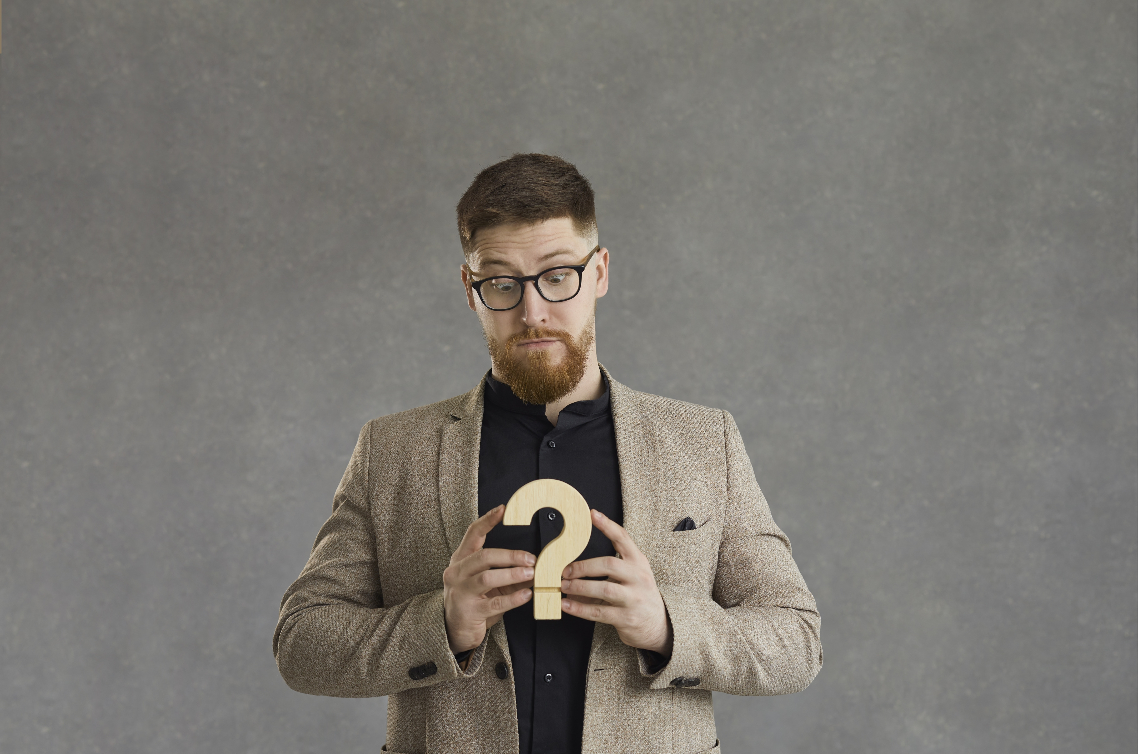 Confused man with question mark | Business Images ~ Creative Market