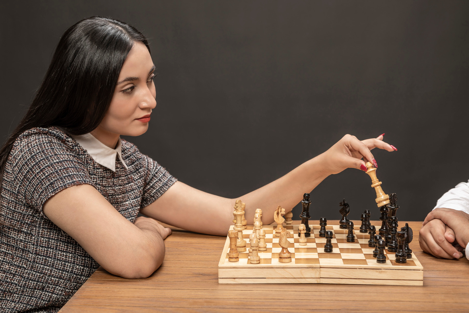 Woman portrait of playing on fine wooden chess board., a Person Photo ...