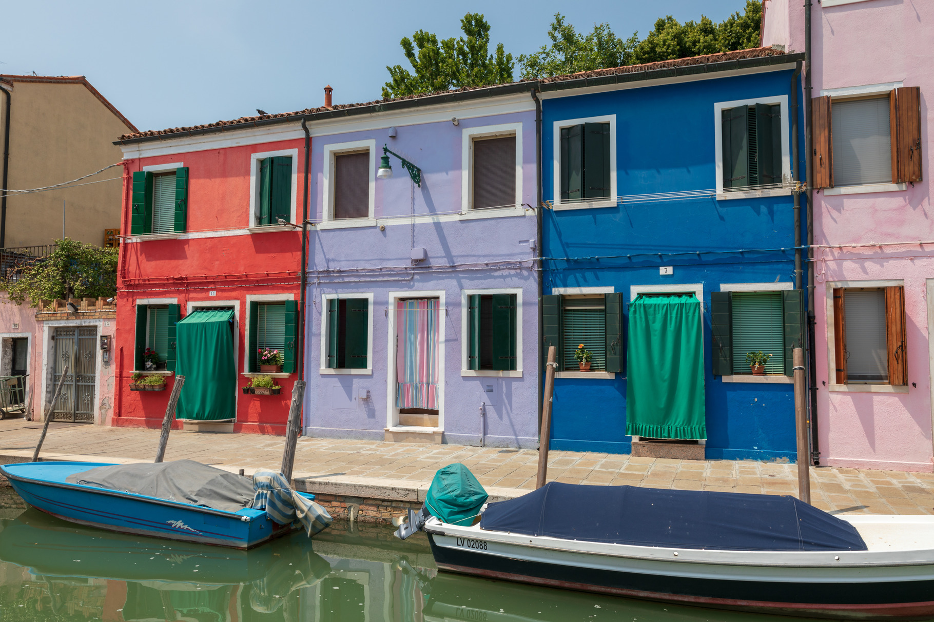 Coloured homes of burano featuring architecture, beautiful, and boat ...