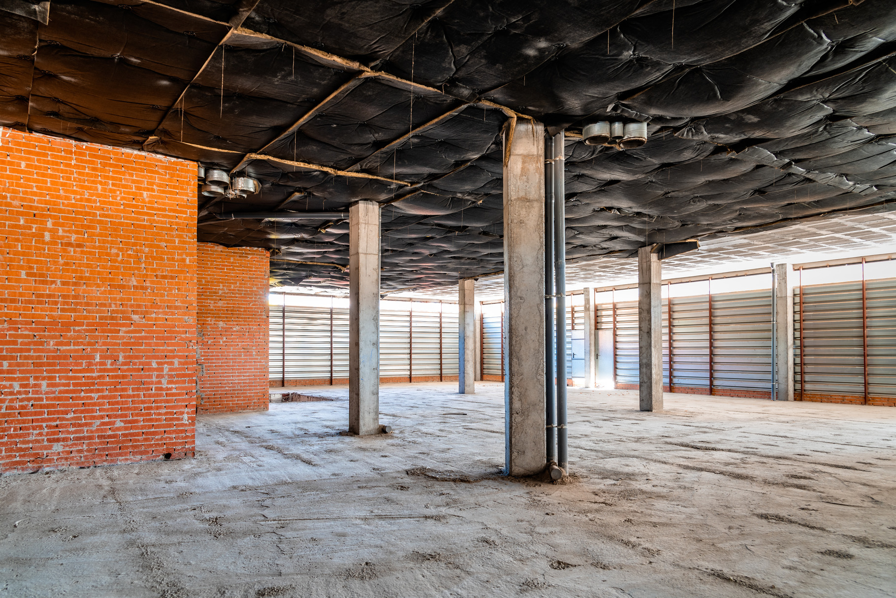 vInterior view of unfurbished commercial space ready for rental, an ...
