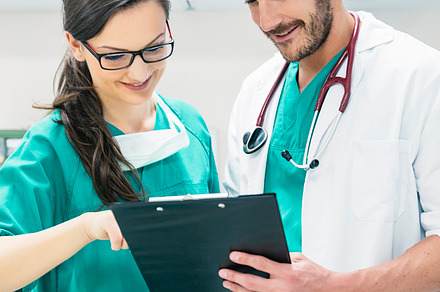 Two nurses using a computer in a x containing nurses, using, and ...