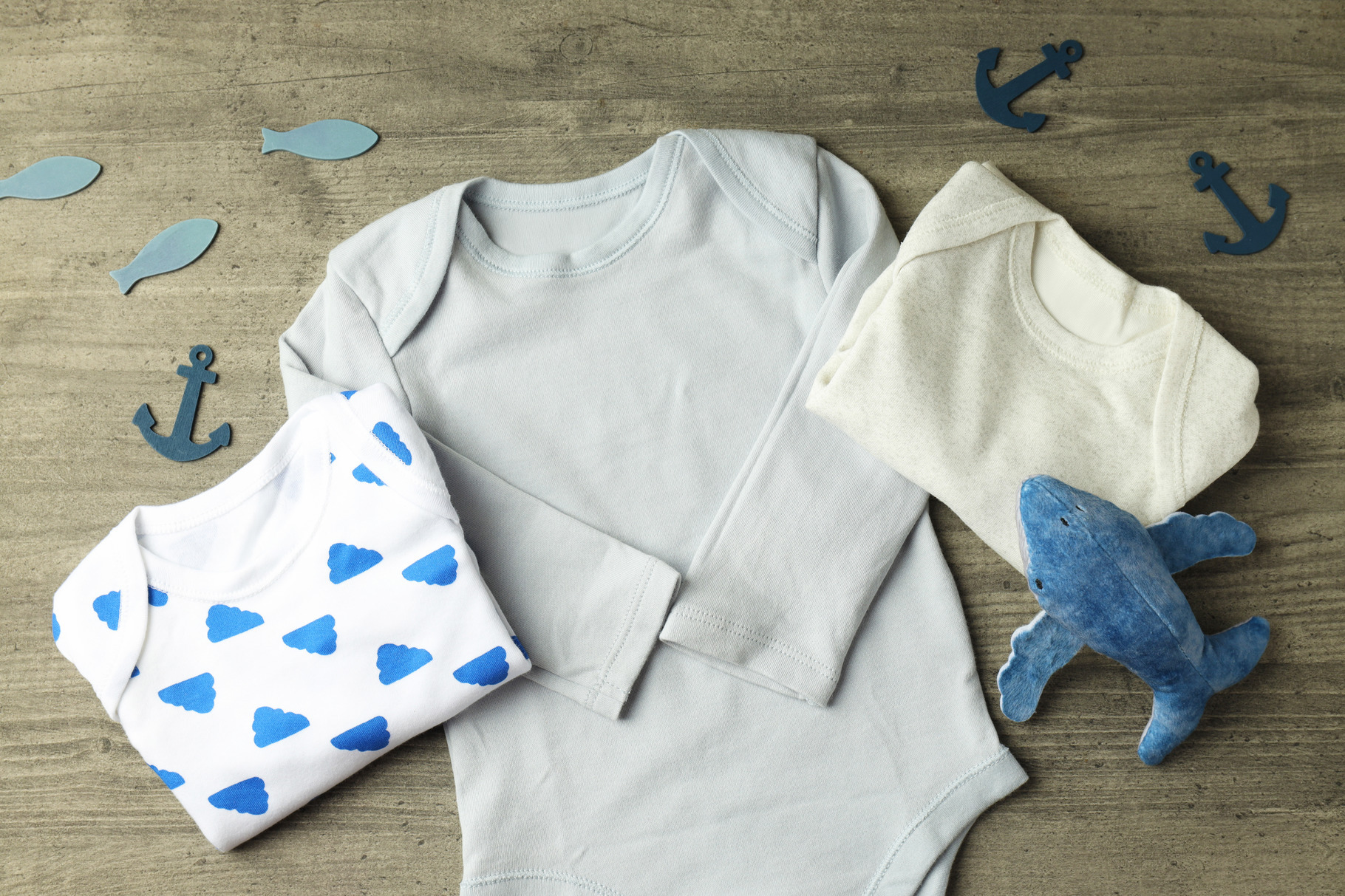 Concept of cute baby clothes on gray textured background, a Beauty ...