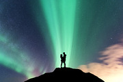 Aurora and hugging couple, a Nature Photo by den-belitsky