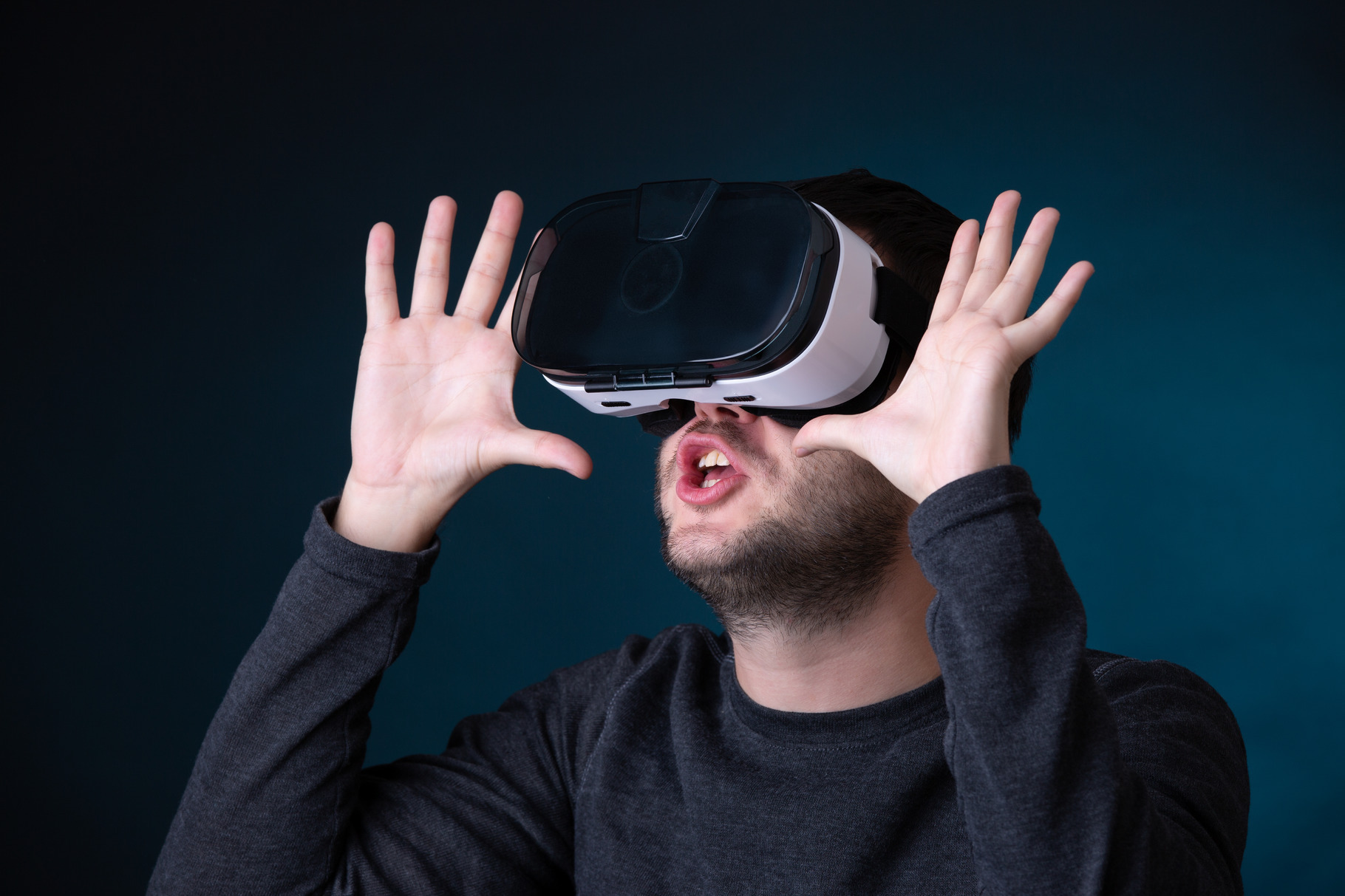 Photo of man in virtual reality containing man, black background, and ...
