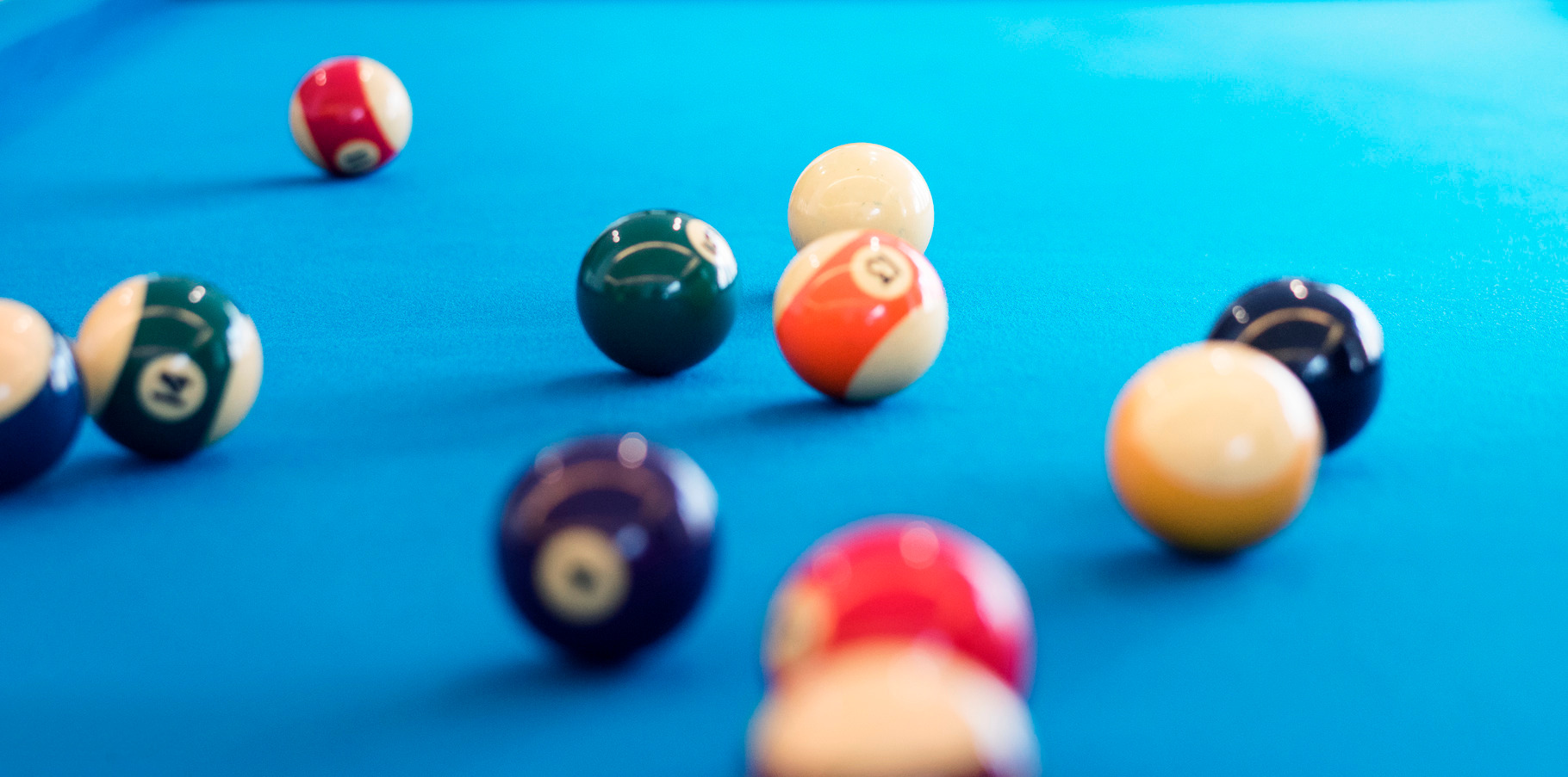 Billiard balls setup on a pool table, a Photo by rawpixel