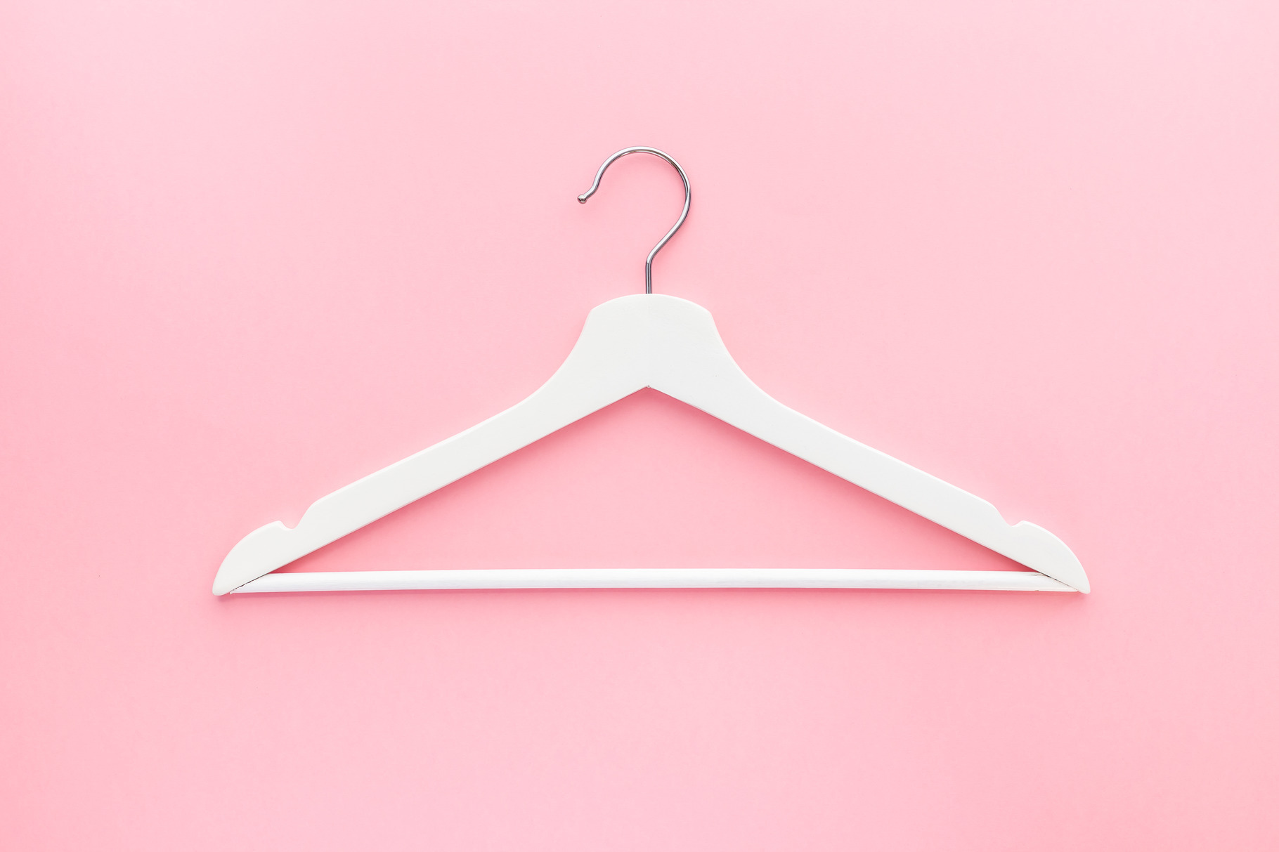 White hangers on pastel pink background, a Beauty & Fashion Photo by ...