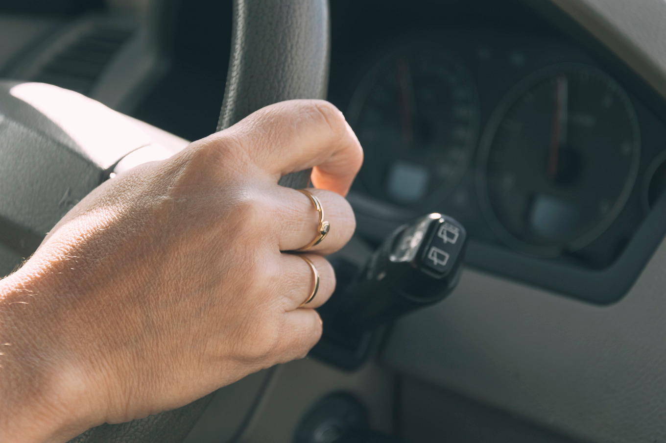 Woman hand driving a car | Transportation Stock Photos ~ Creative Market