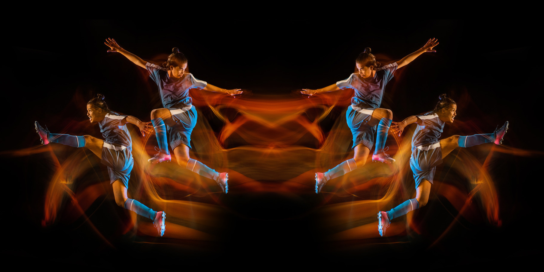 Football or soccer player on black studio background in mixed light ...