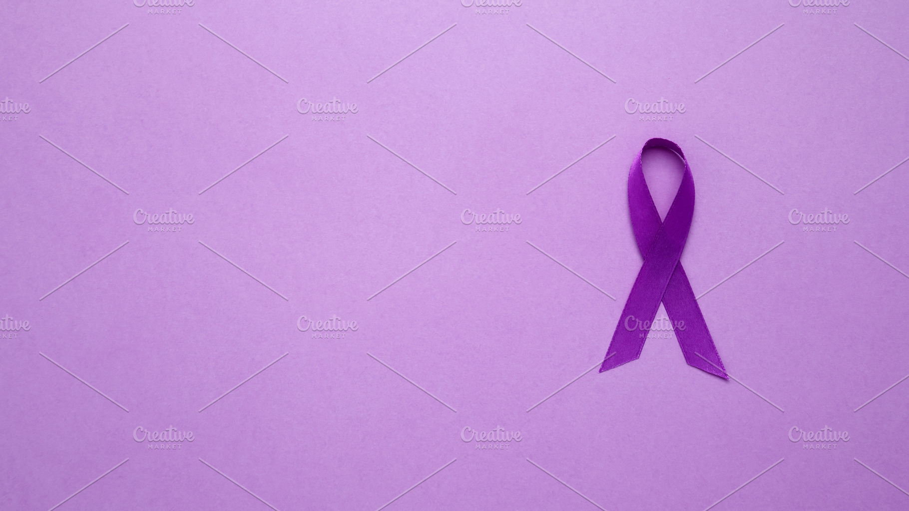 Purple ribbon held, symbol of support. Purple Epilepsy Awareness Day, a ...