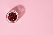 Krill oil pills on a pastel pink background with copy space, a Food ...