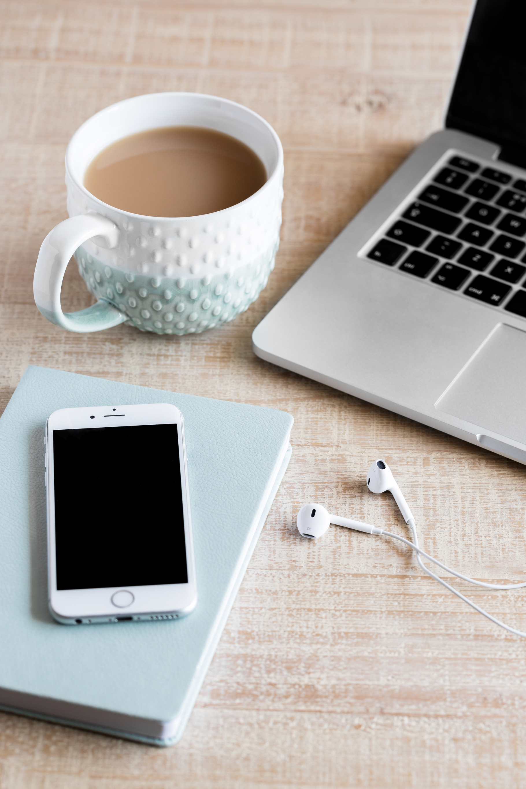 Workspace With Laptop, Phone & Tea, a Business Photo by Moyo Studio